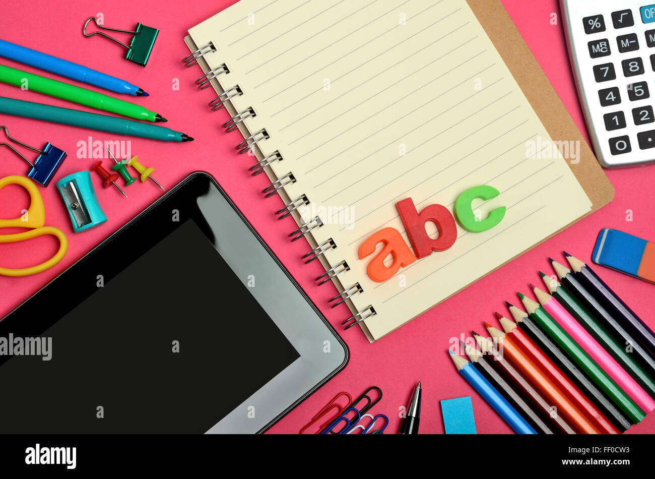 School objects and digital tablet on table Stock Photo - Alamy