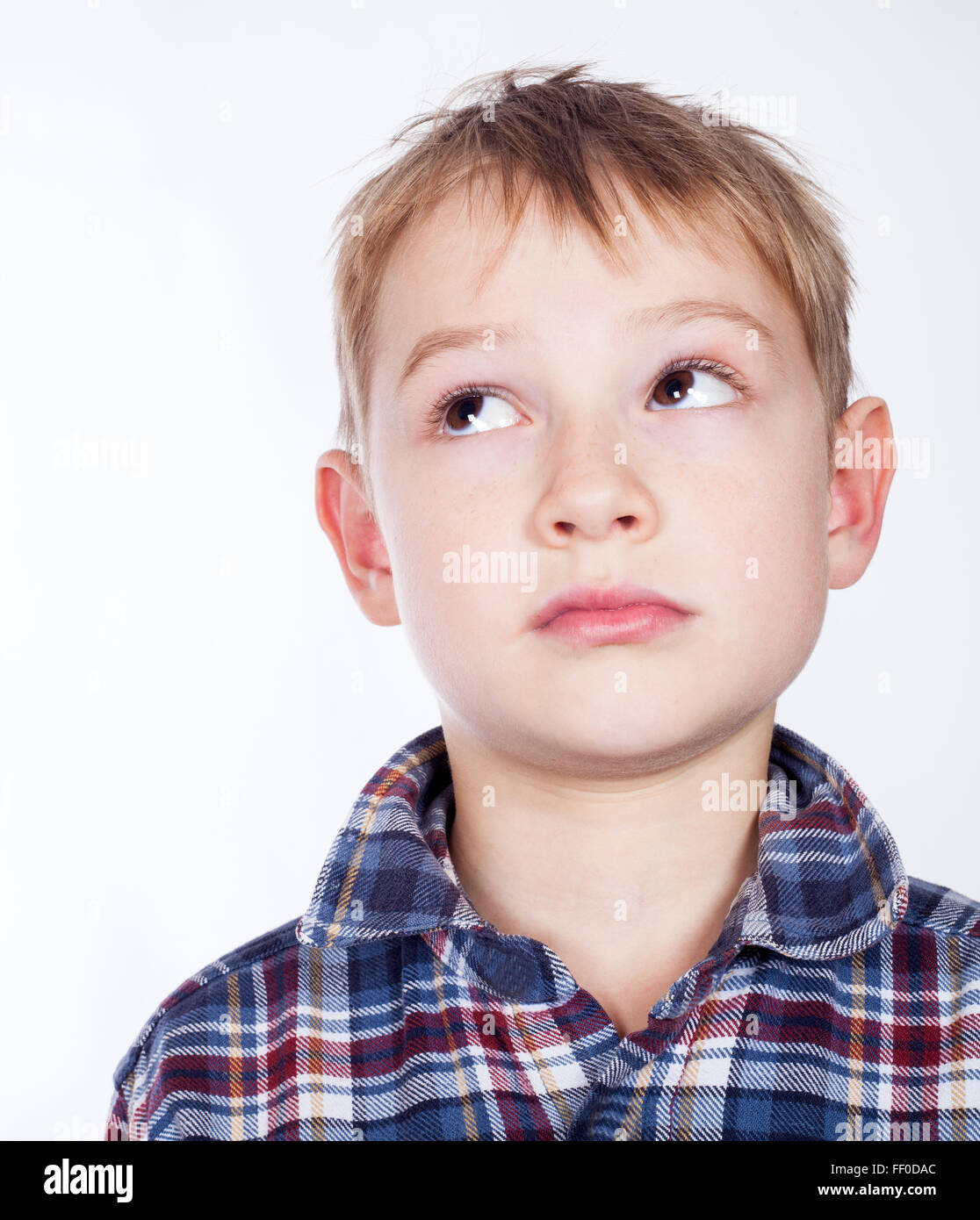 Portrait of boy looking up Stock Photo - Alamy