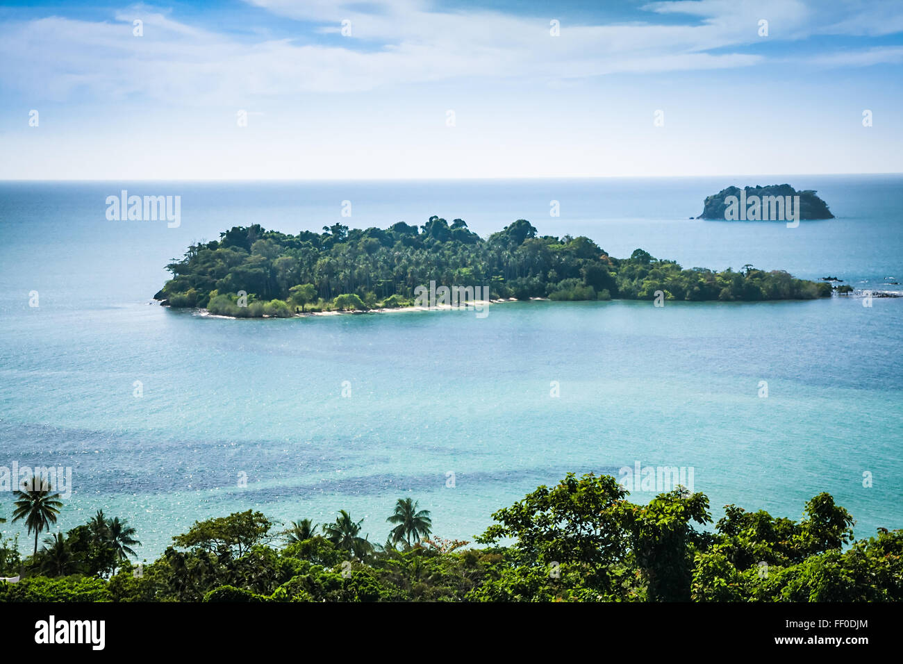 Remote tropical island in turquoise colored transparent sea Stock Photo ...