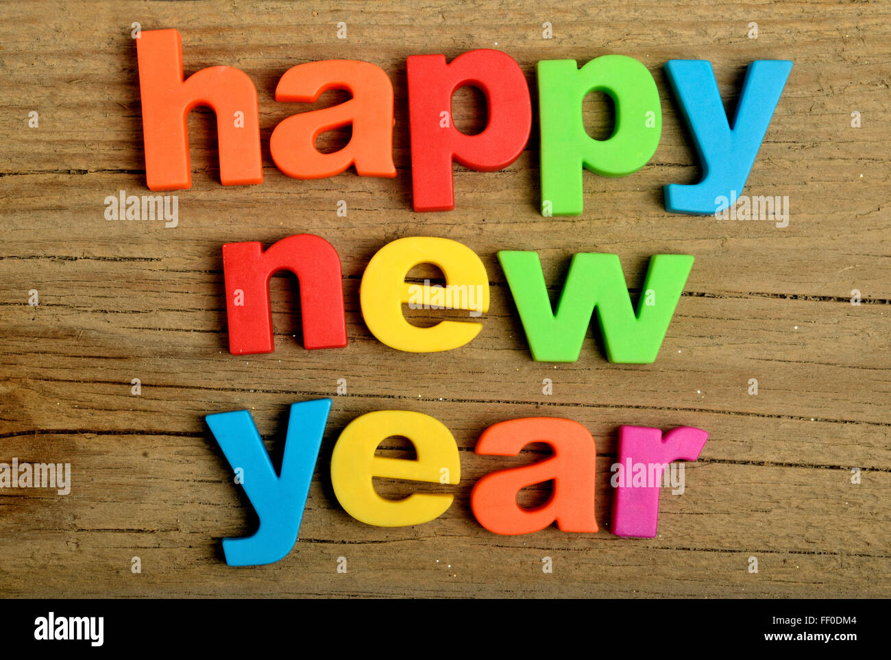 Happy New Year word on wooden table Stock Photo - Alamy