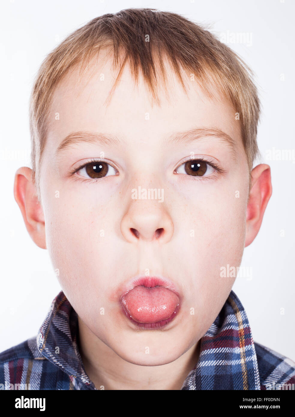 Boy showing a tongue Stock Photo - Alamy