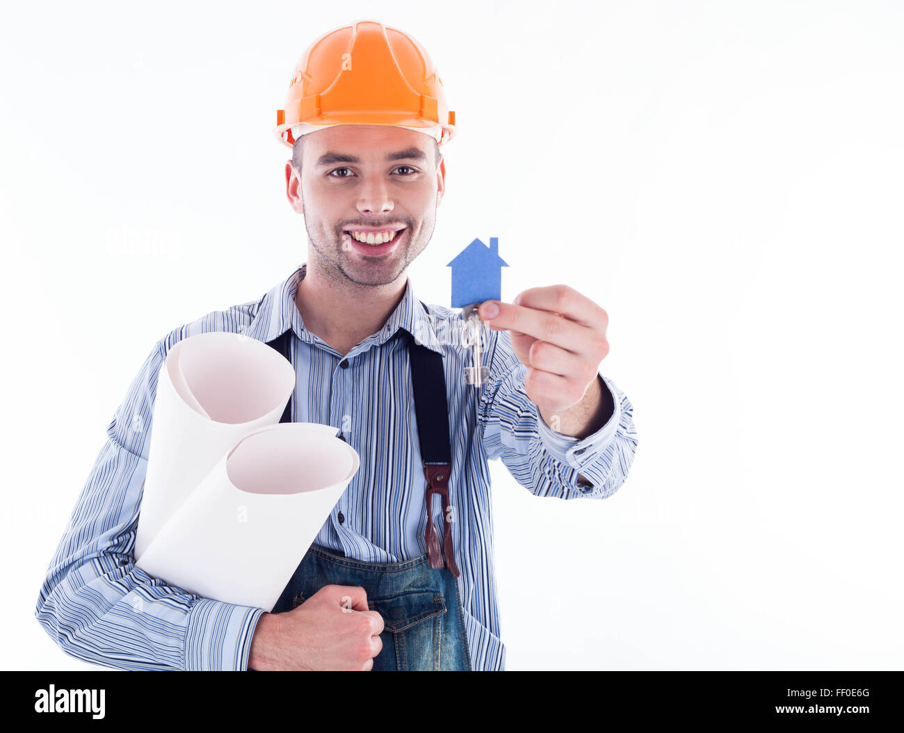 A builder man holding a key and a paper house Stock Photo - Alamy