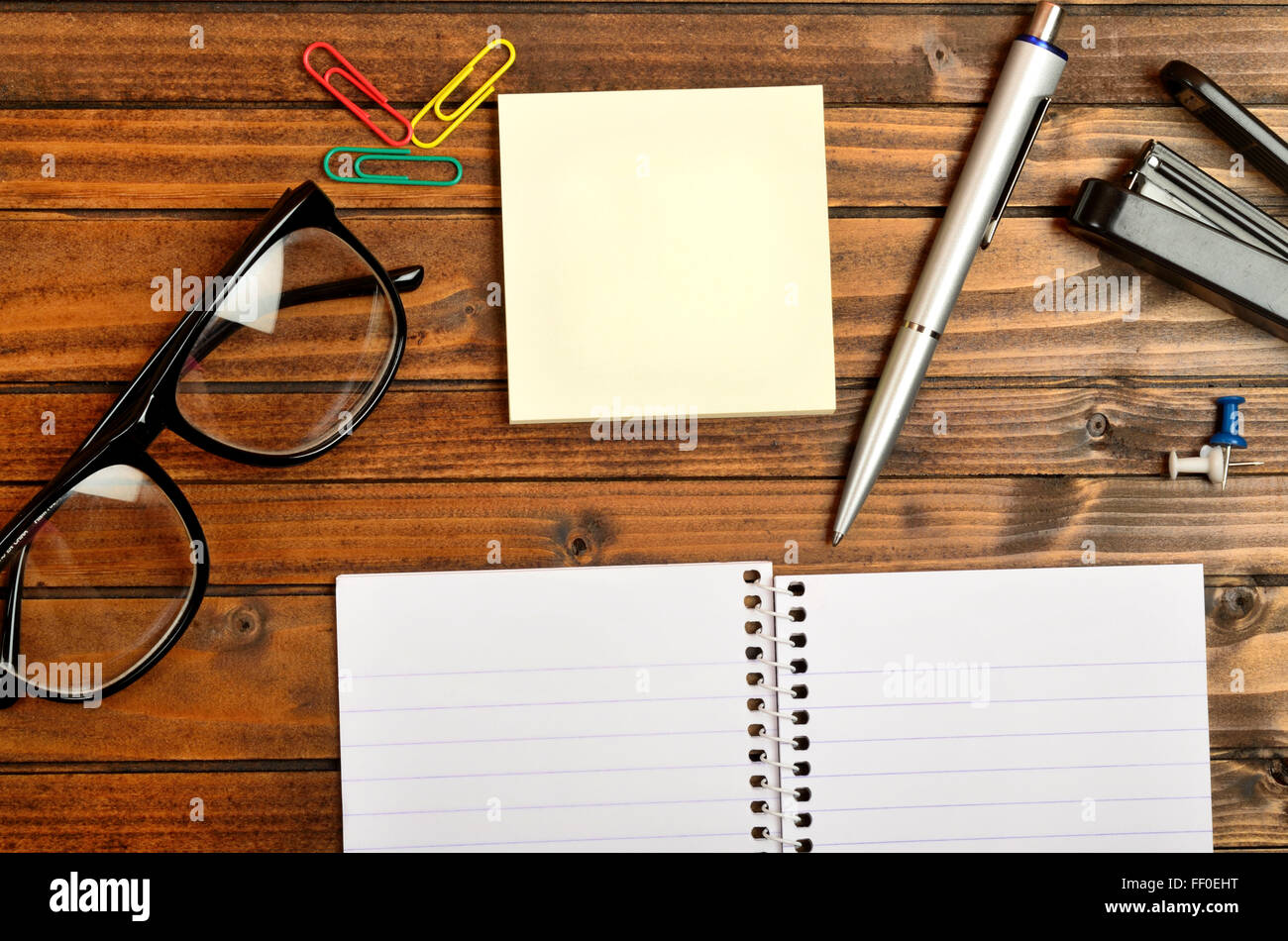 Office supply on wooden table Stock Photo - Alamy