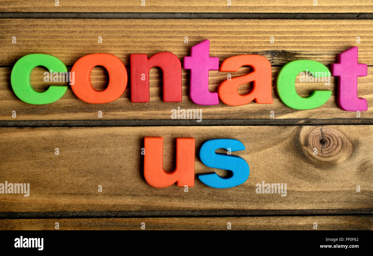 Colorful Contact Us word on wooden table Stock Photo - Alamy
