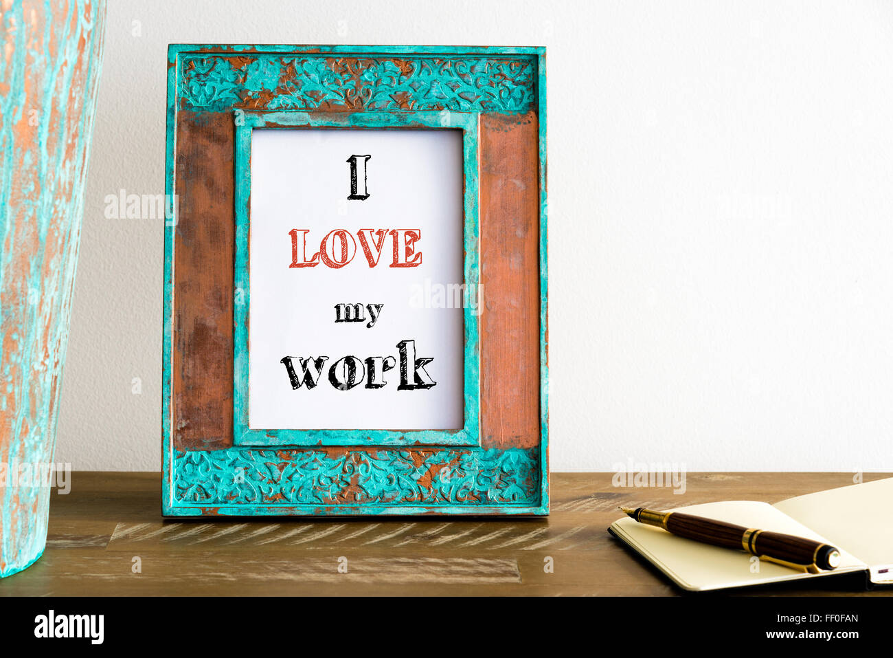Vintage photo frame on wooden table over white wall background with ...