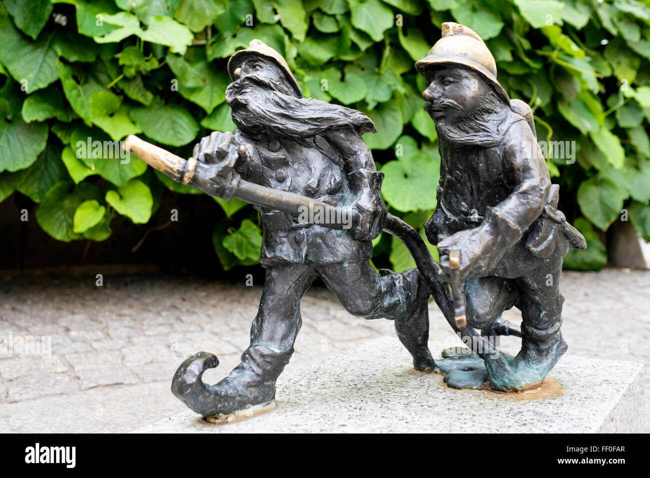 Two of the many famous gnomes and dwarfs spread around the Polish city ...
