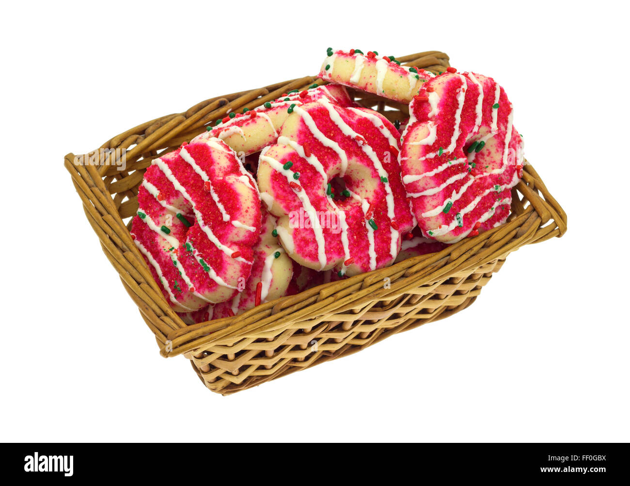 A group of holiday decorated shortbread cookies in a small wicker ...