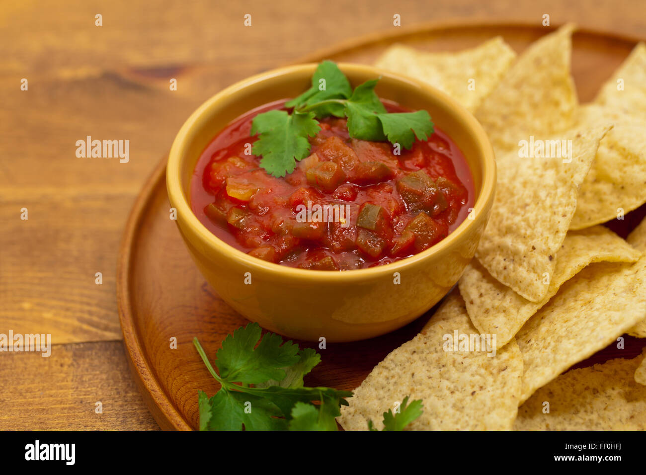 Spicy Red Salsa with tortilla chips Stock Photo - Alamy