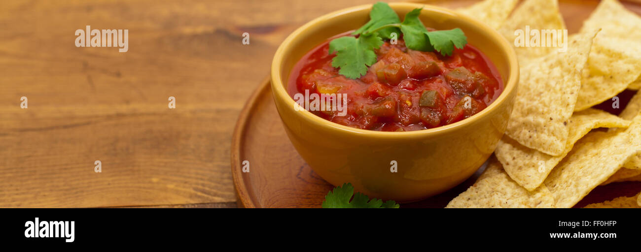 Spicy Red Salsa with tortilla chips Stock Photo - Alamy