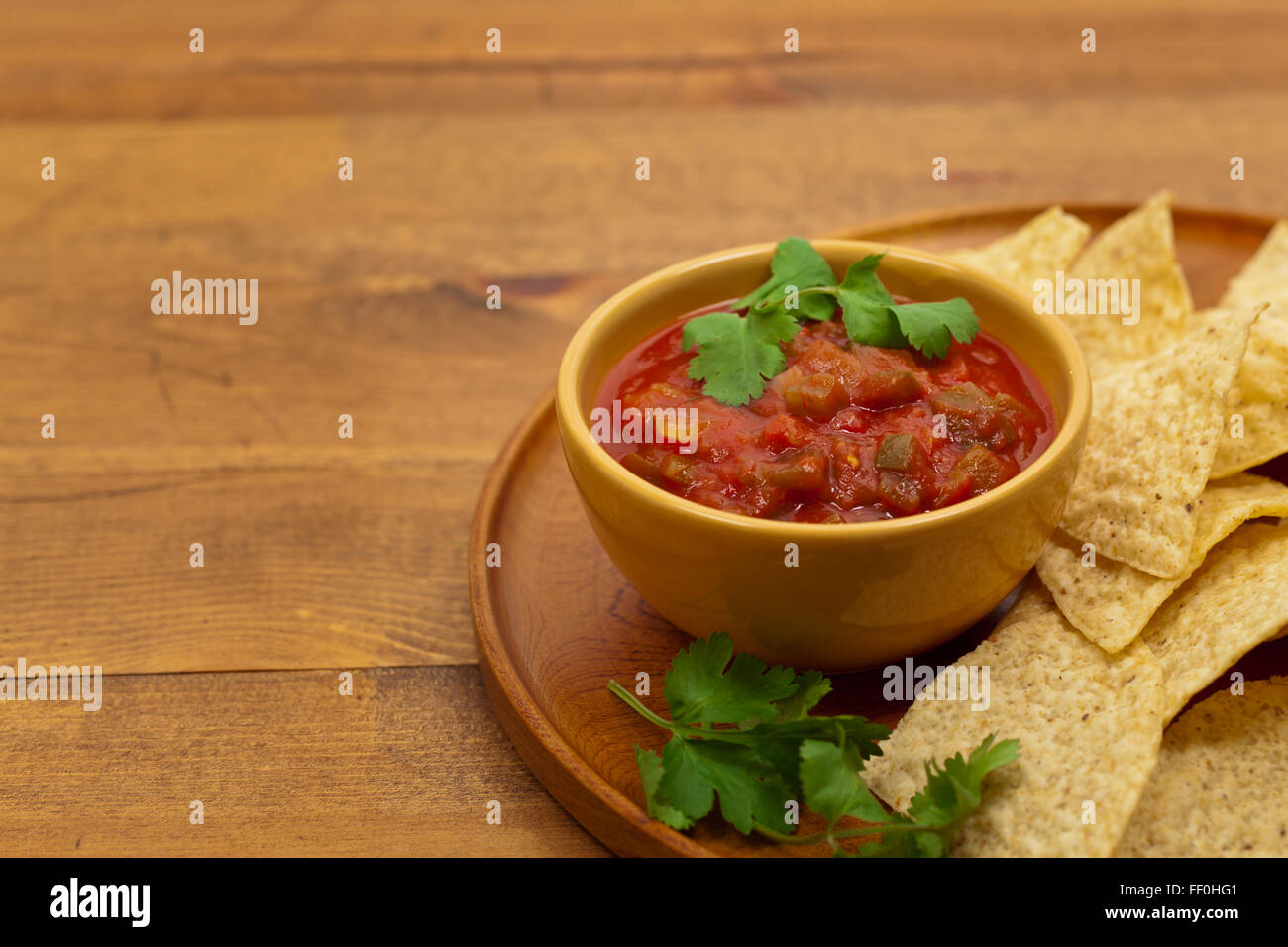 Spicy Red Salsa with tortilla chips Stock Photo - Alamy
