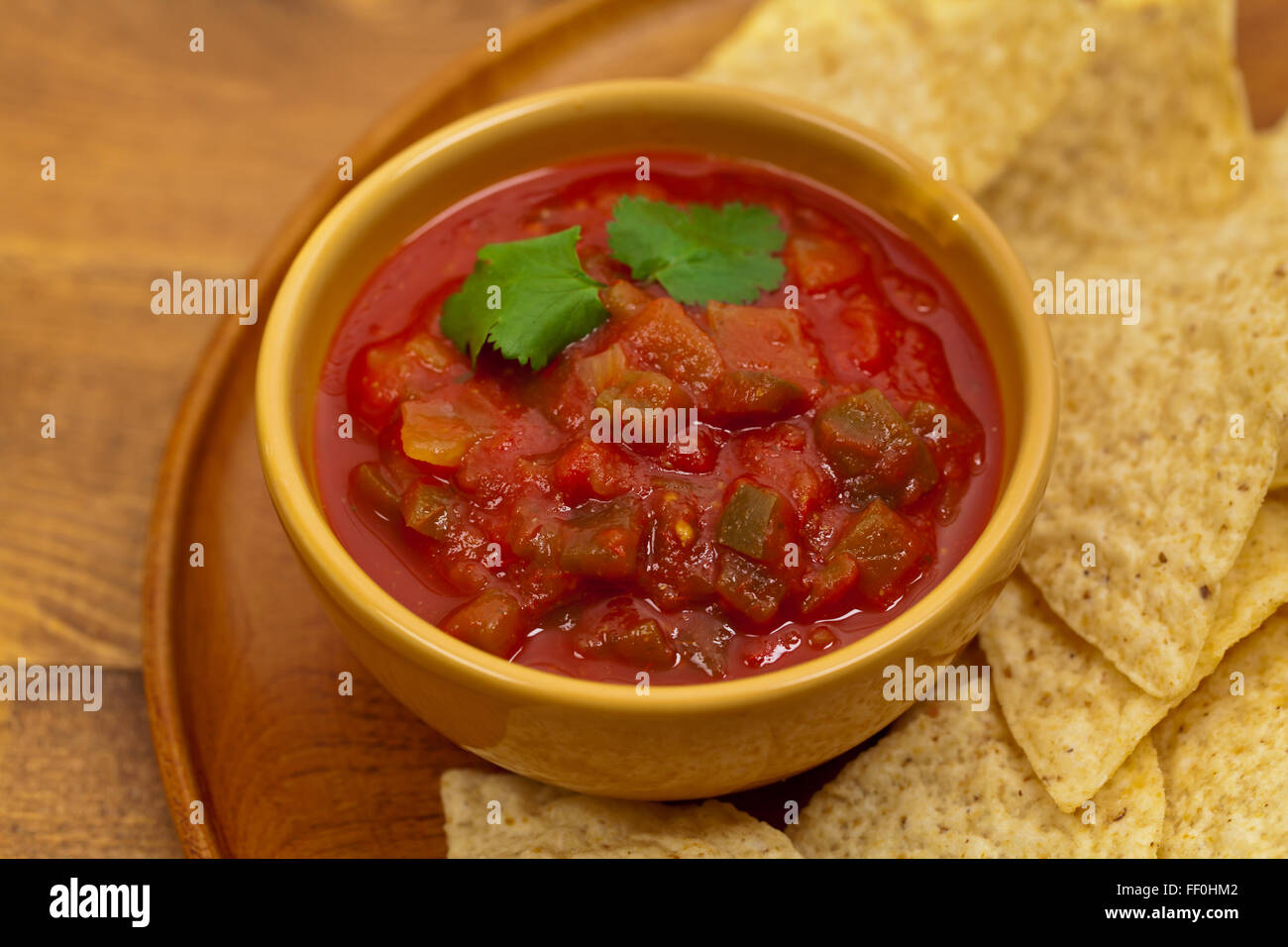Spicy Red Salsa with tortilla chips Stock Photo - Alamy