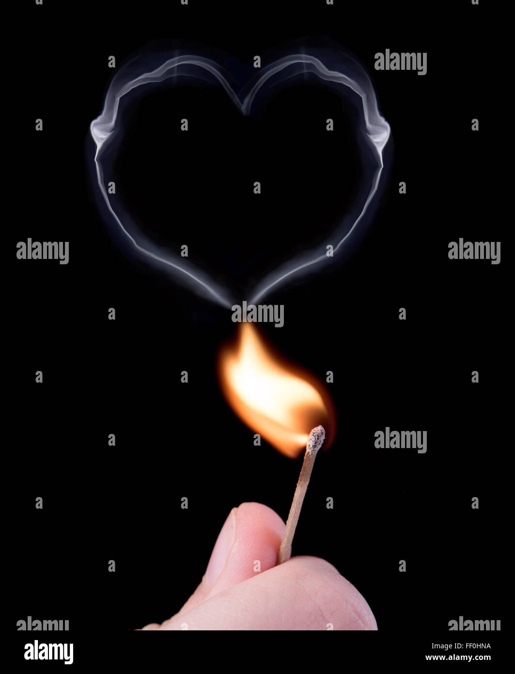heart smoke with flame held by fingers Stock Photo - Alamy