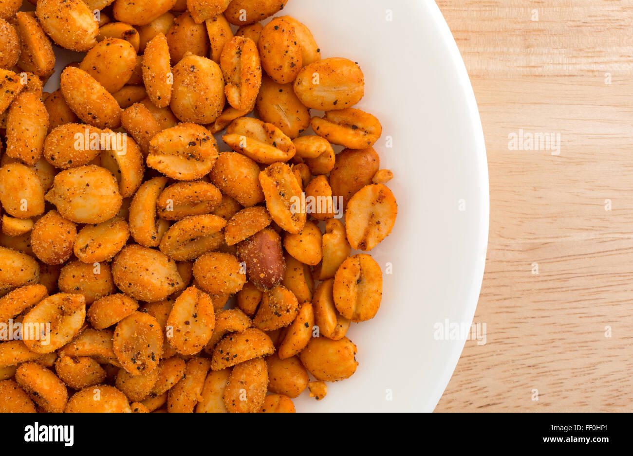 Top close view of a portion of hot and spicy peanuts isolated on a ...