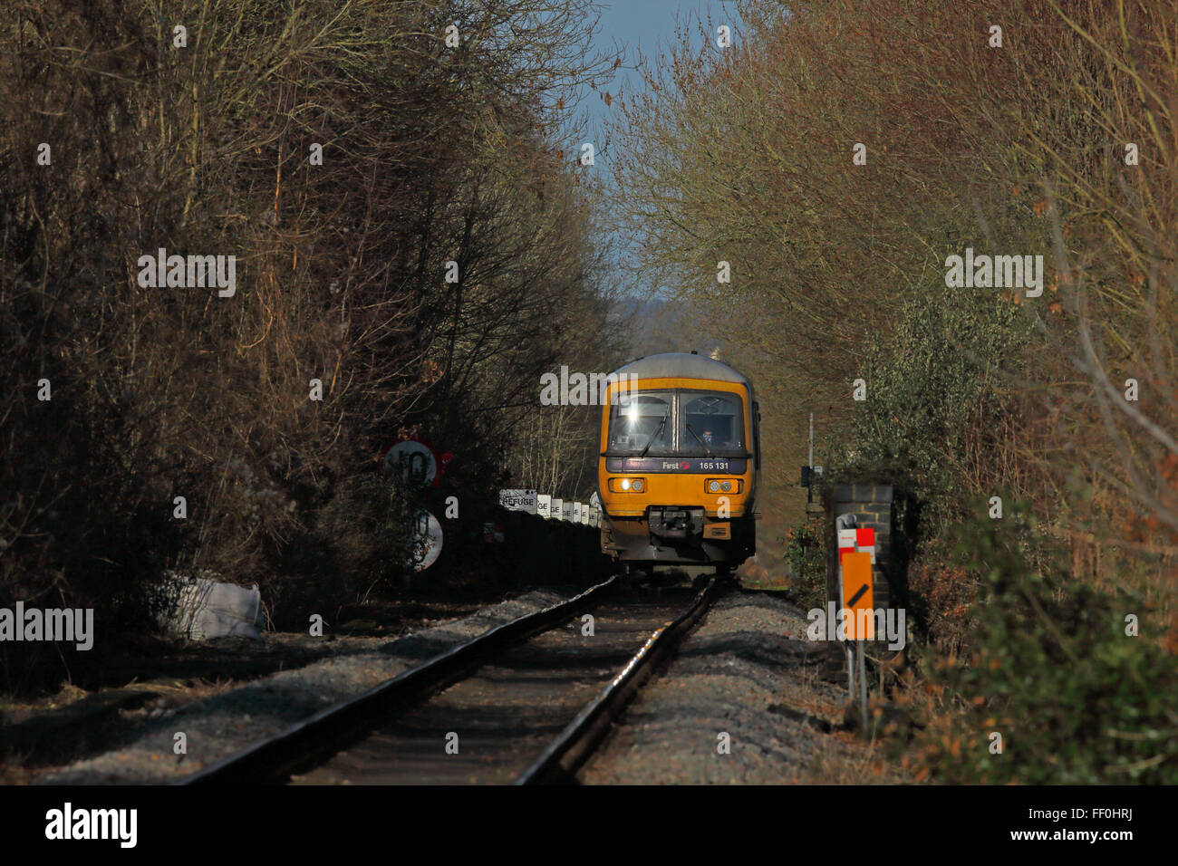 A slowly approaching class 165 Diesel Multiple unit crossing Shiplake ...