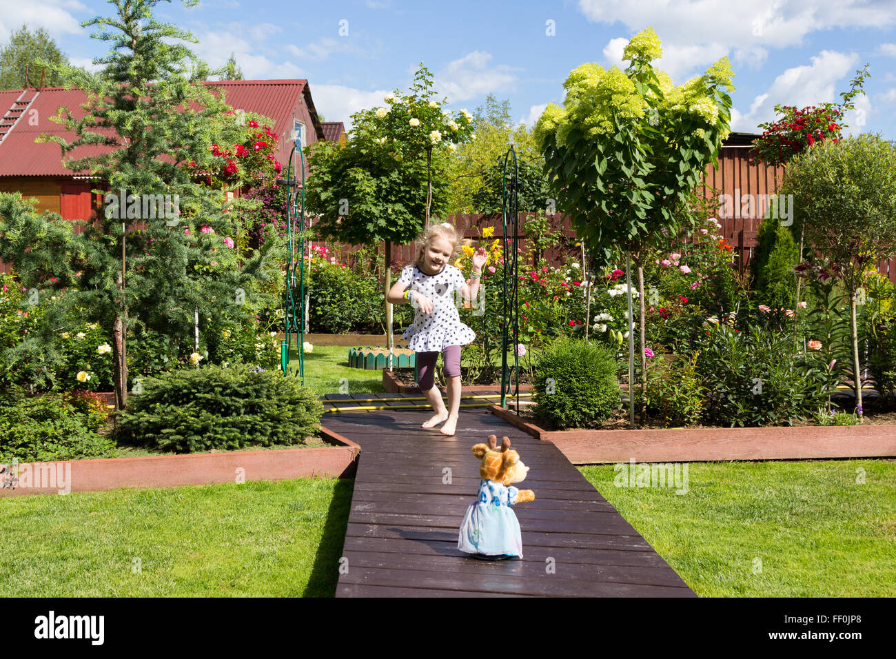 girl dancing in a beautiful blooming garden Stock Photo - Alamy