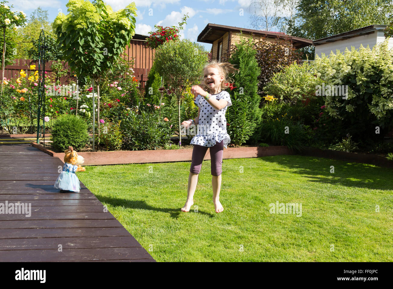Beautiful girl dancing in flower hi-res stock photography and images ...