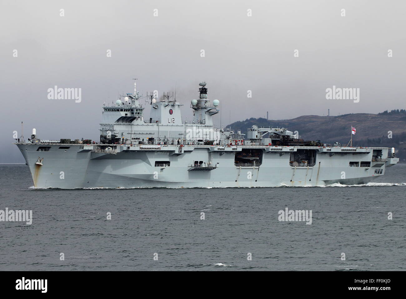 HMS Ocean (L12), an amphibious assault vessel of the Royal Navy, heads ...