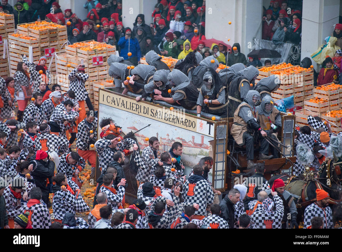The traditional 'battle of the oranges' held during the Ivrea Carnival ...