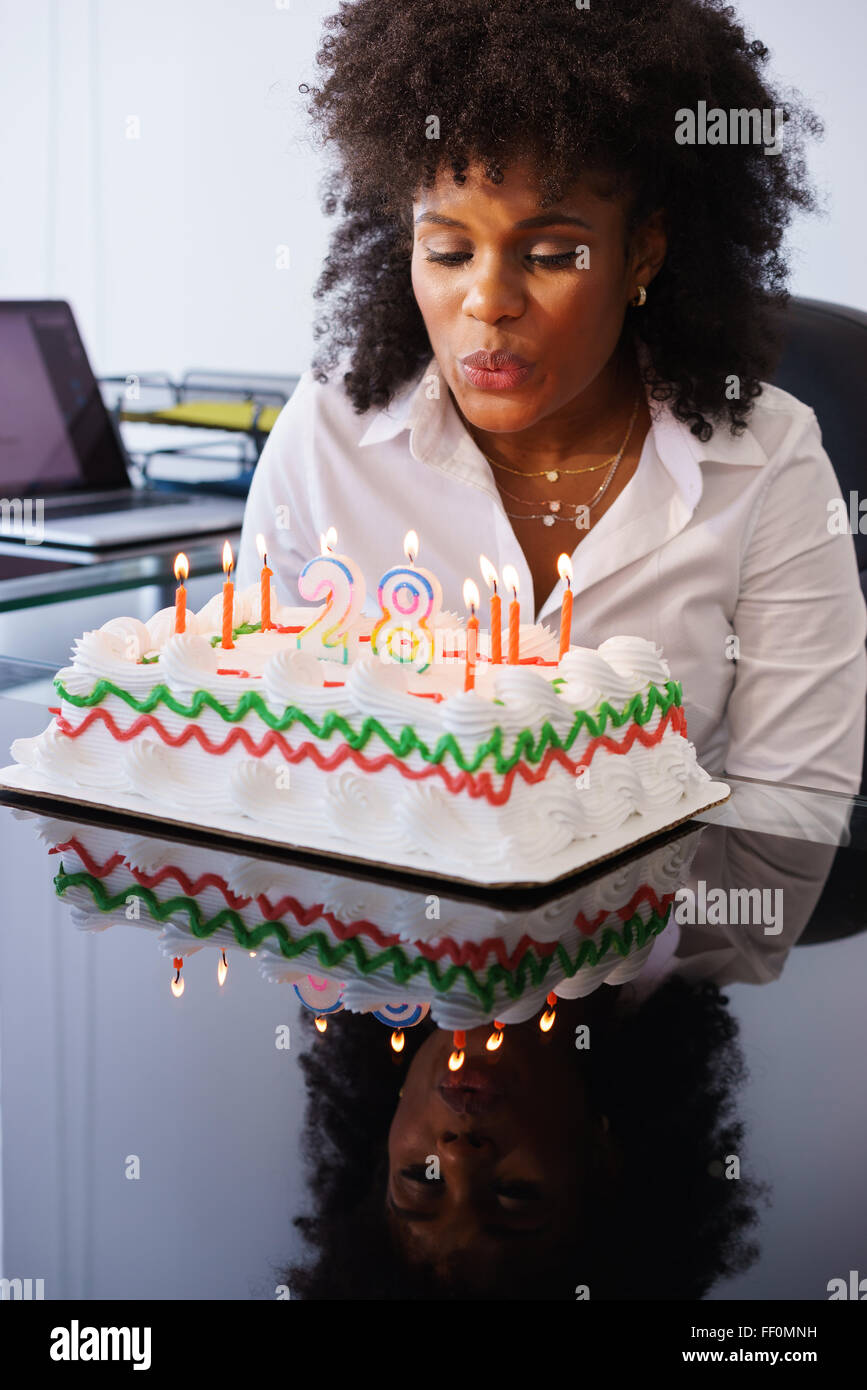 Business person celebrating 28 years and doing a party in office. She ...