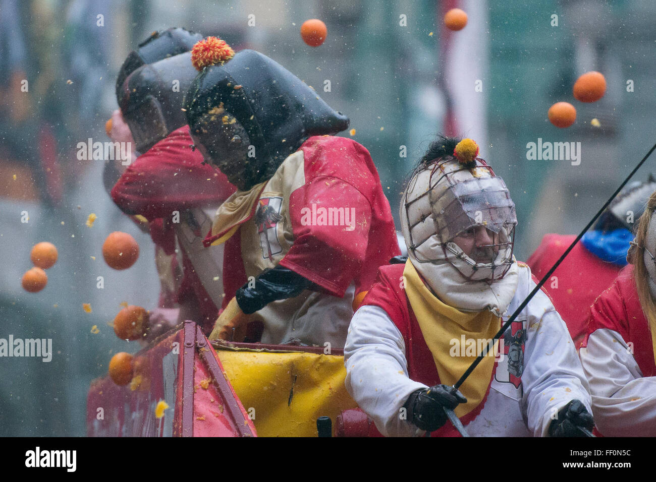 The traditional 'battle of the oranges' held during the Ivrea Carnival ...