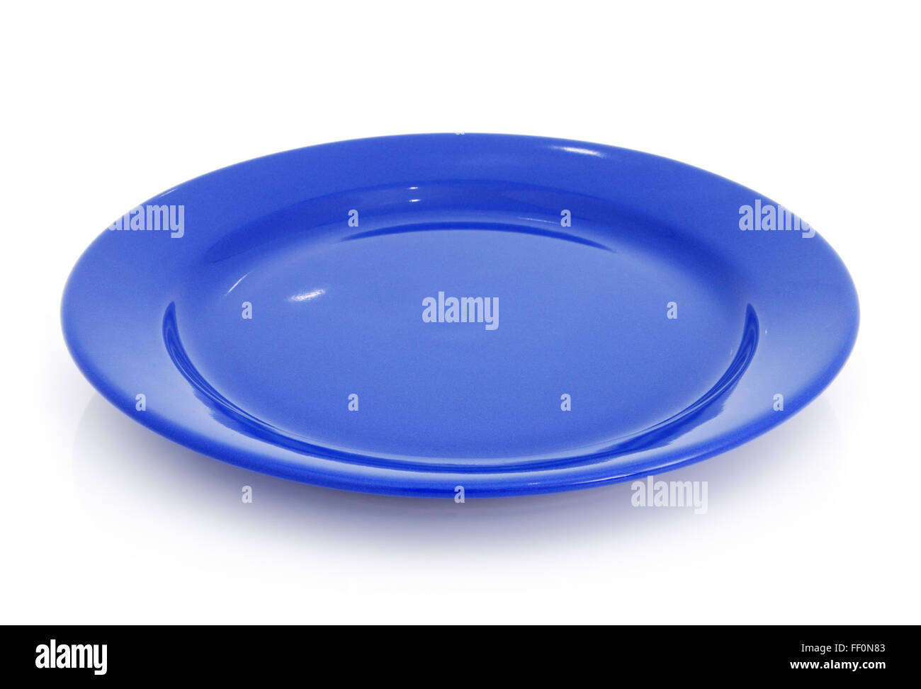 Blue ceramic plate isolated on a white background Stock Photo - Alamy