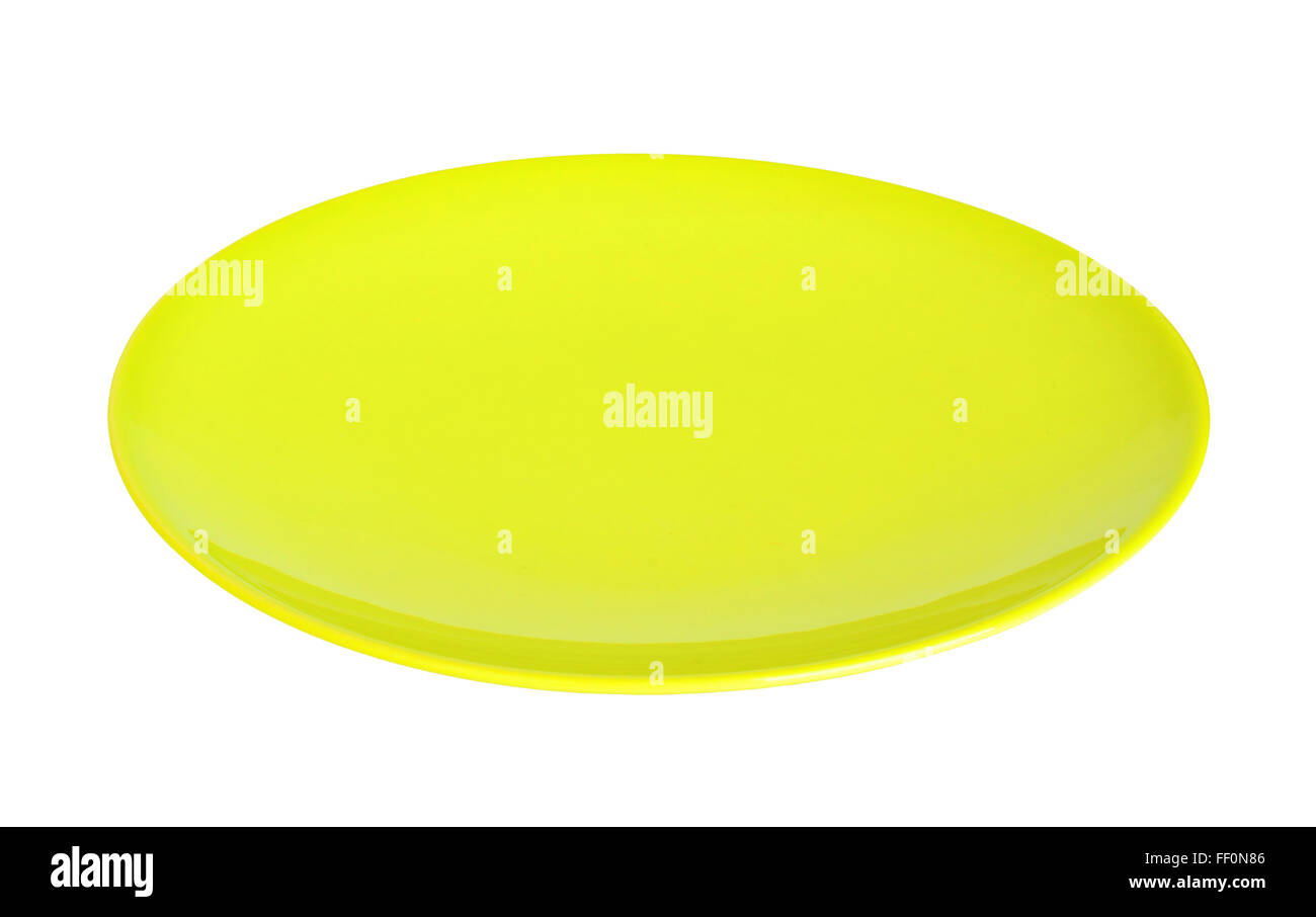 Empty yellow plate isolated on a white background Stock Photo - Alamy