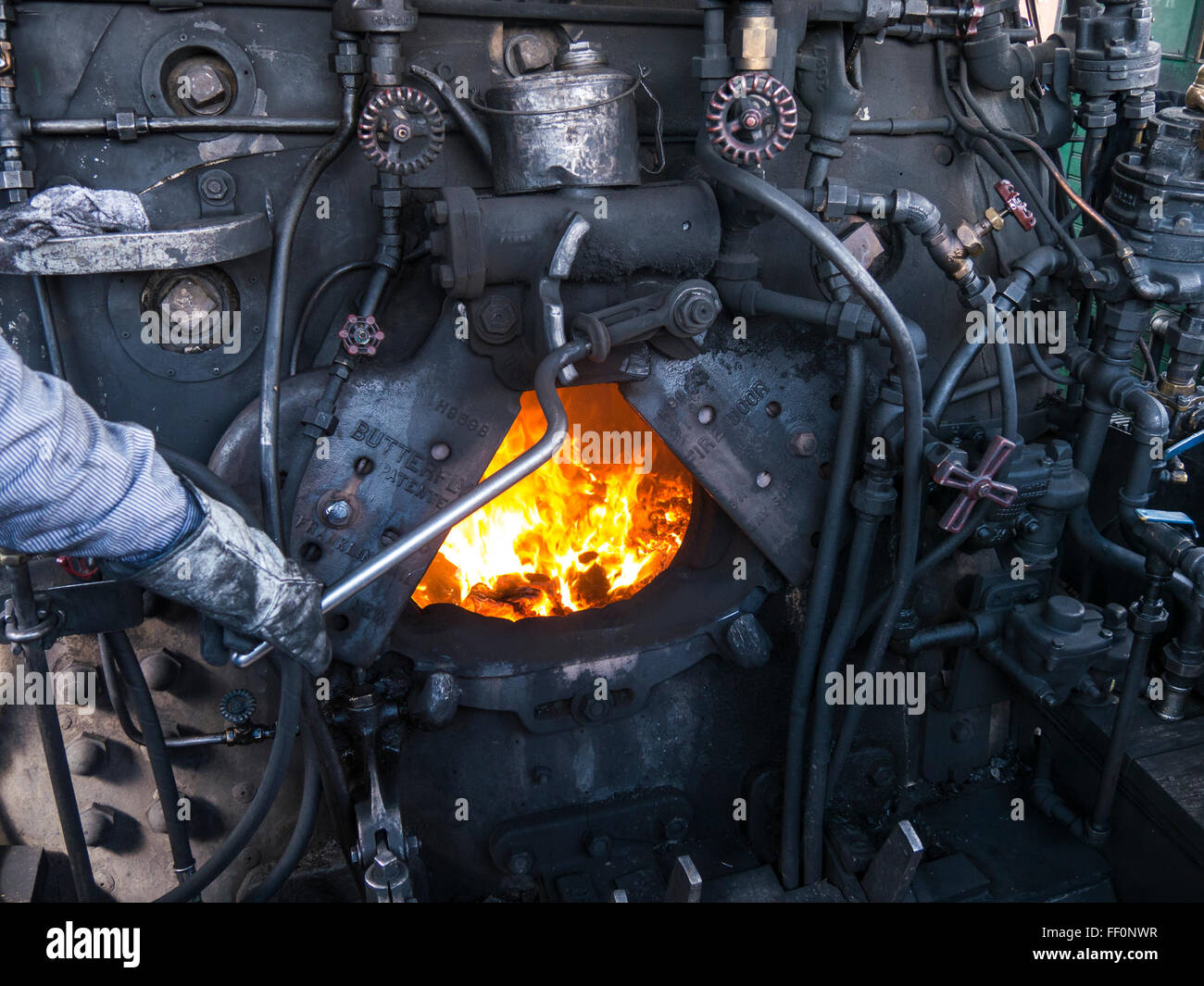Stoking The Fire Stock Photos & Stoking The Fire Stock Images - Alamy