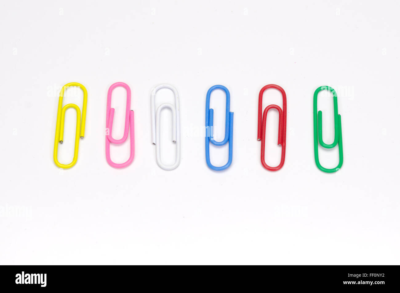 Colorful paper clip isolated on white background Stock Photo - Alamy