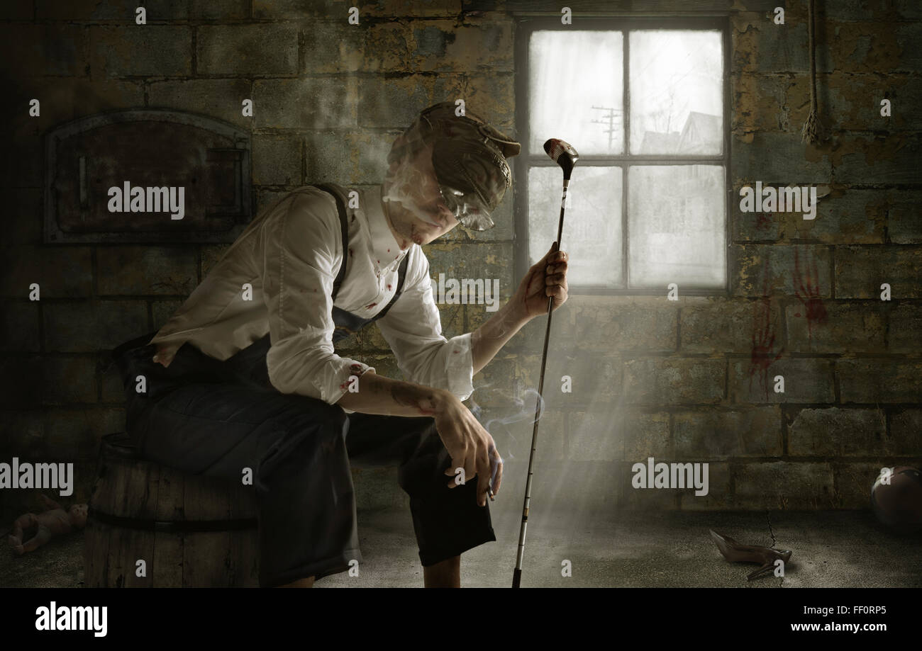 Man smoking cigarette with golf club Stock Photo - Alamy