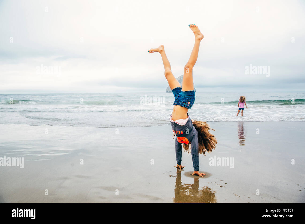 Playing handstand hi-res stock photography and images - Alamy