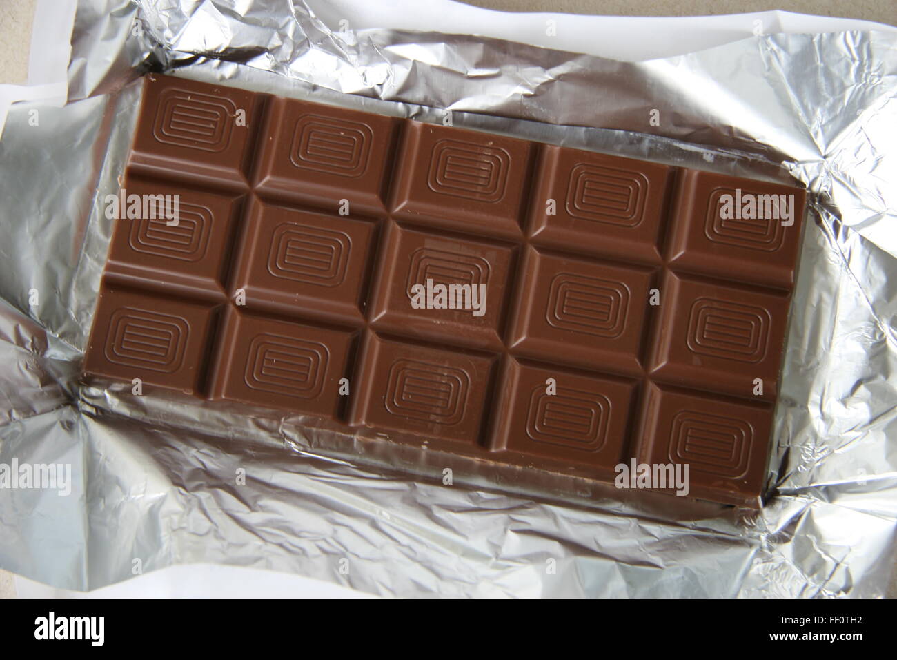 a tablet of milk chocolate Stock Photo - Alamy