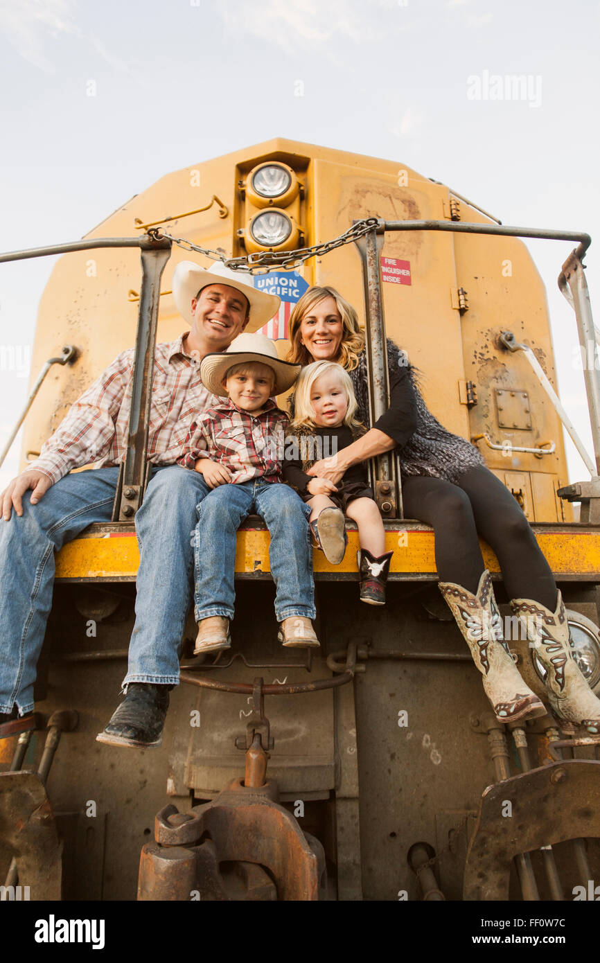 Family sitting on vintage train Stock Photo - Alamy