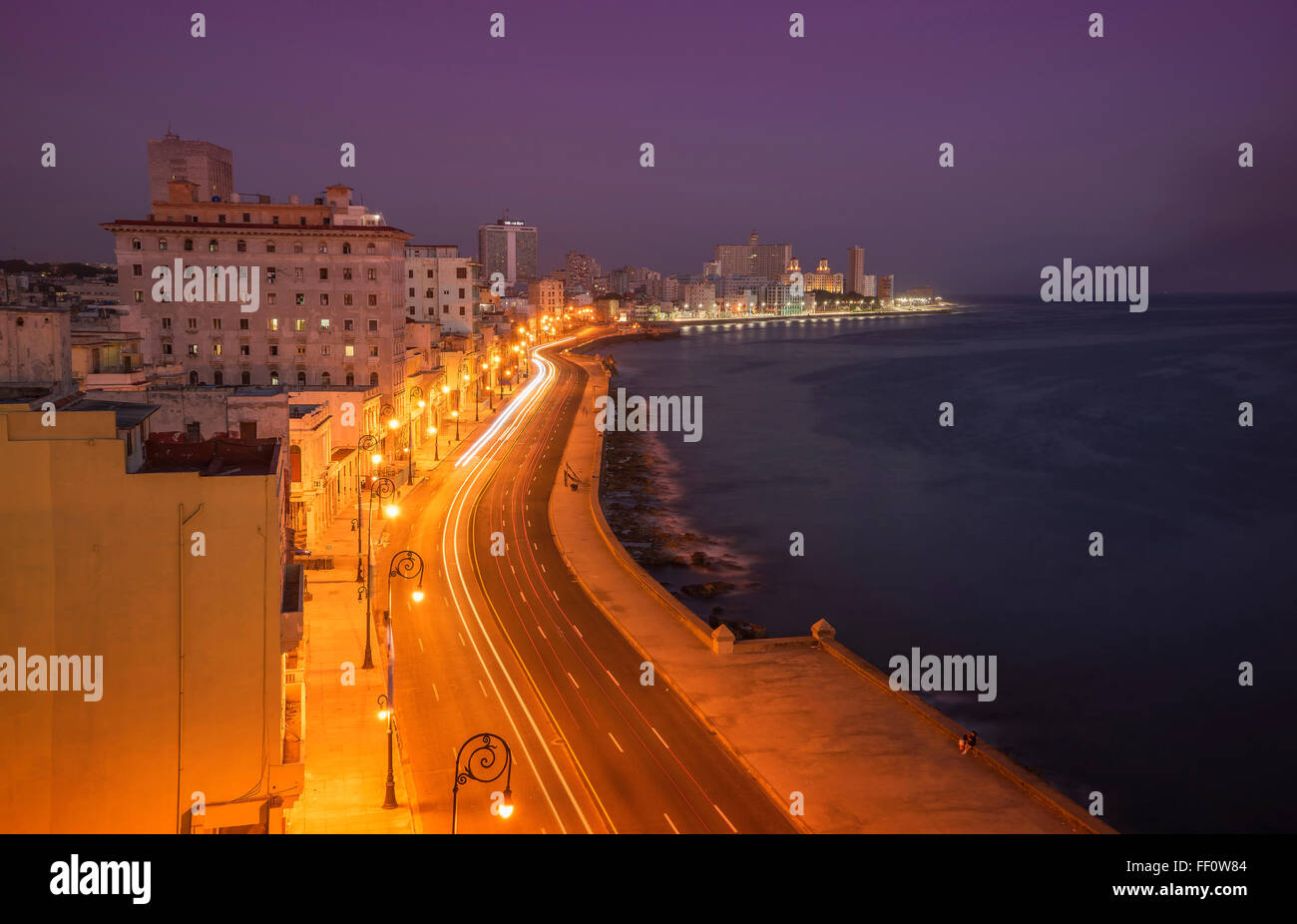 Long exposure of cars on waterfront at night, Havana, Cuba Stock Photo ...