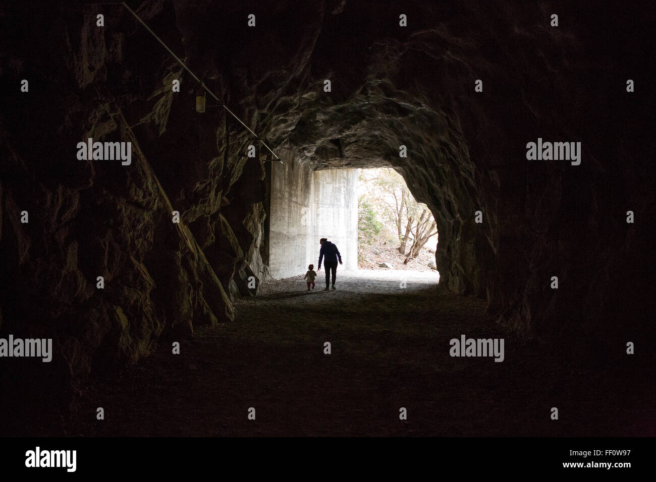 Caucasian mother and daughter walking in cave Stock Photo - Alamy
