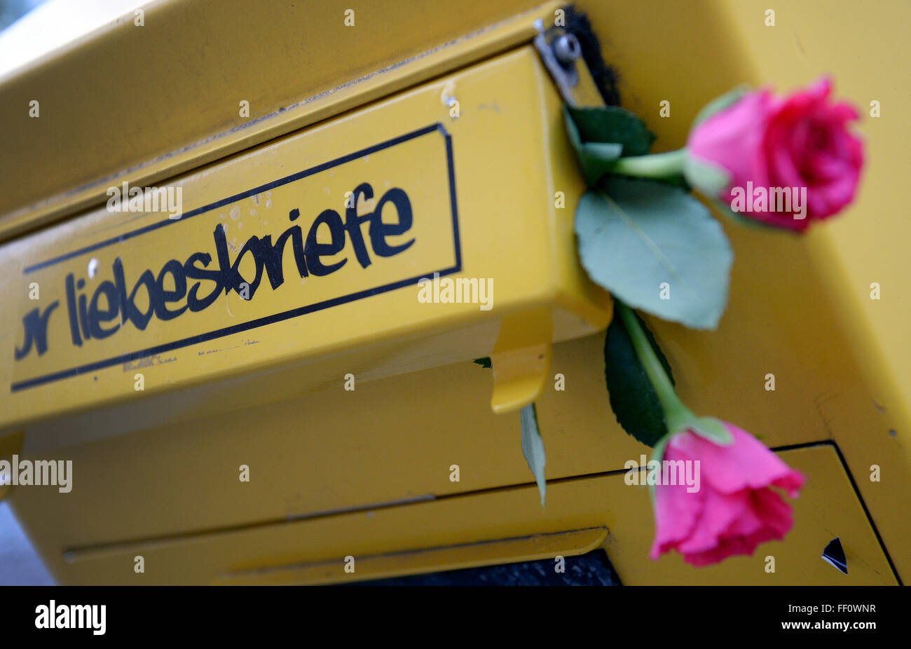 A letter box reading 'Liebesbriefe' (lit. 'Love letters') with roses ...