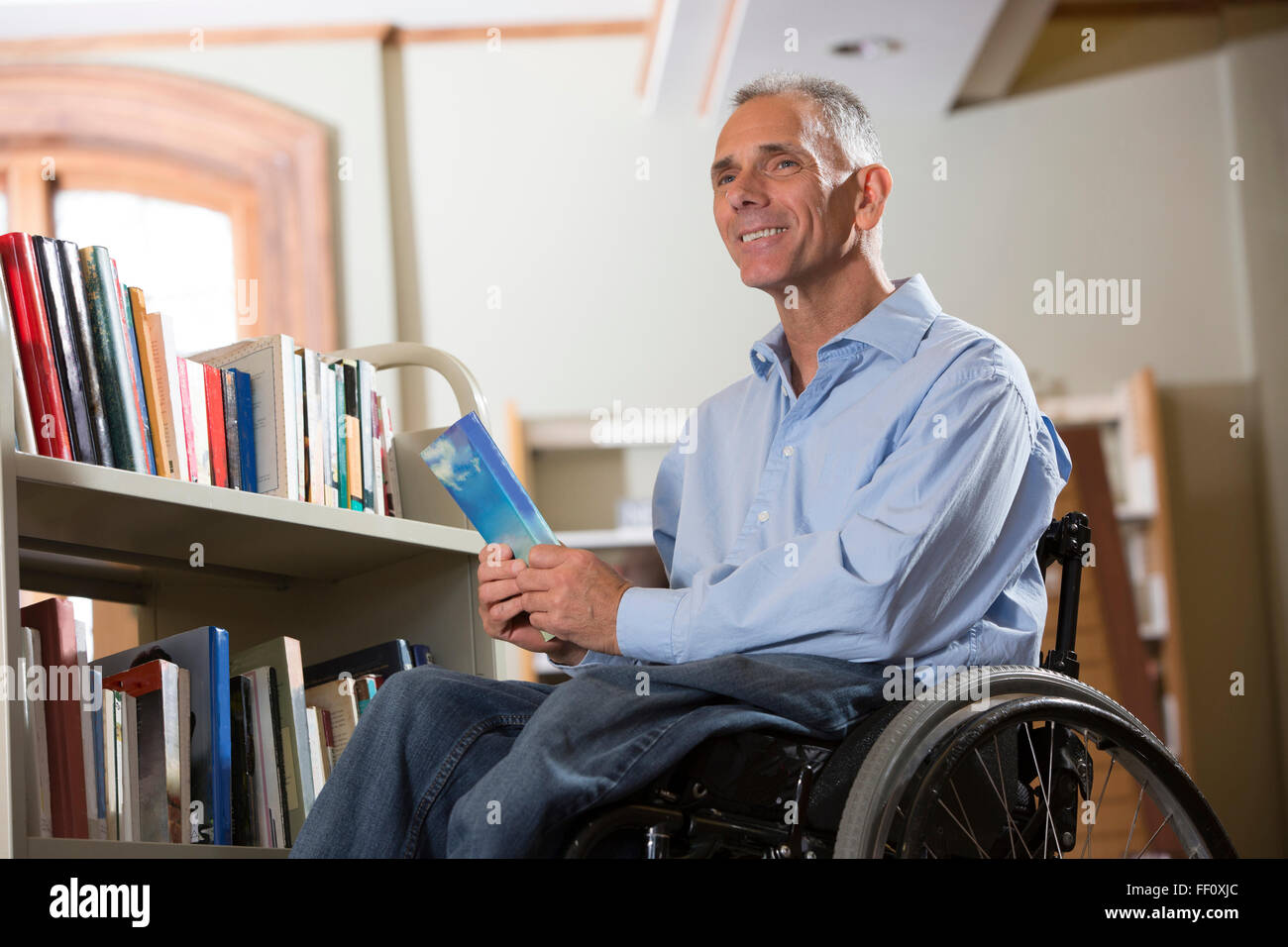One holding book hi-res stock photography and images - Alamy