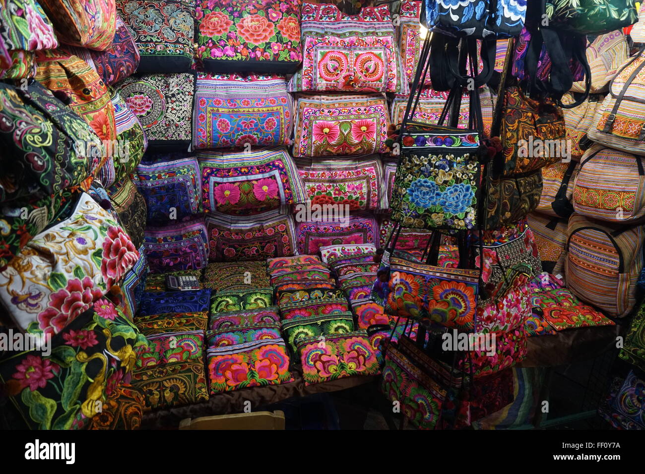 colourful hill tribe embroidery handicraft, bags and purses at night ...