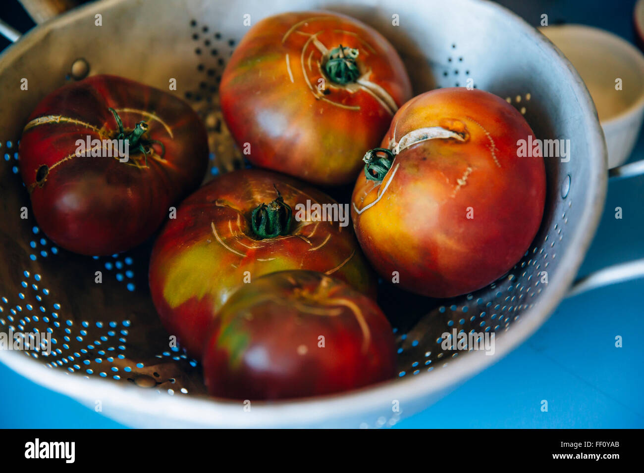 Tomato in colander hi-res stock photography and images - Alamy
