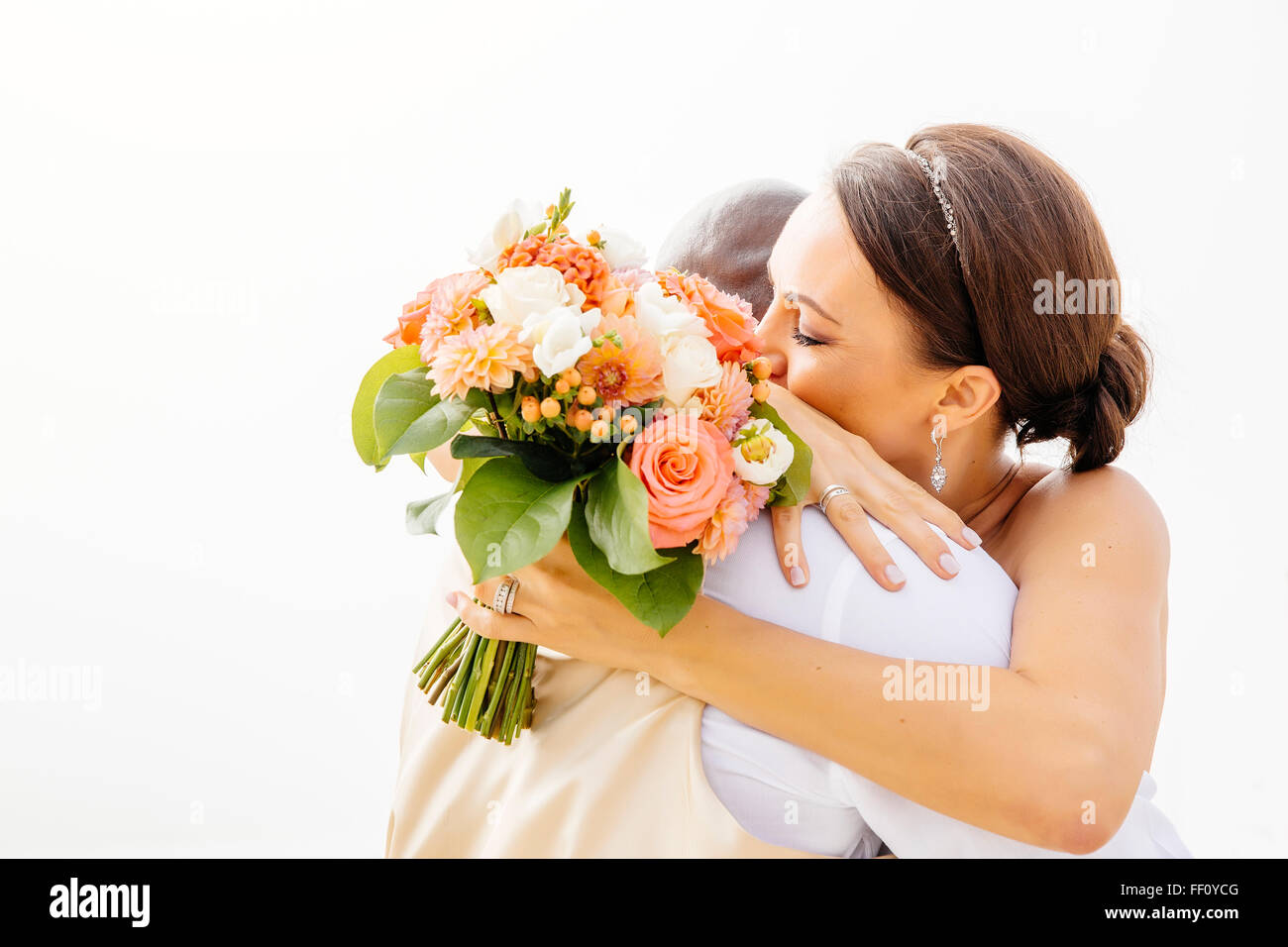 Bride and groom hugging in outdoor wedding Stock Photo - Alamy
