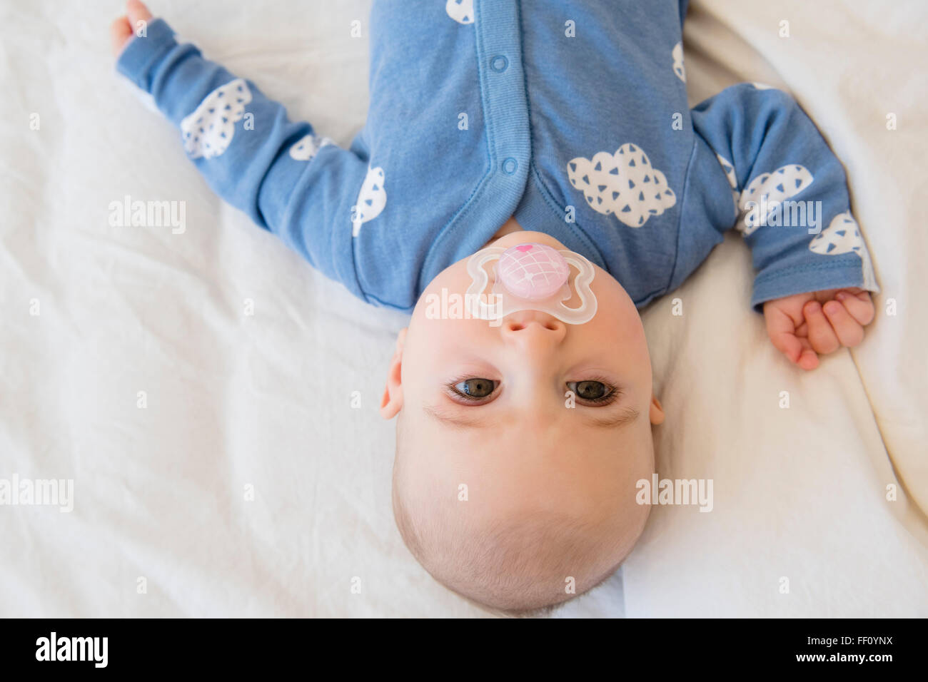 Caucasian baby girl with pacifier Stock Photo - Alamy
