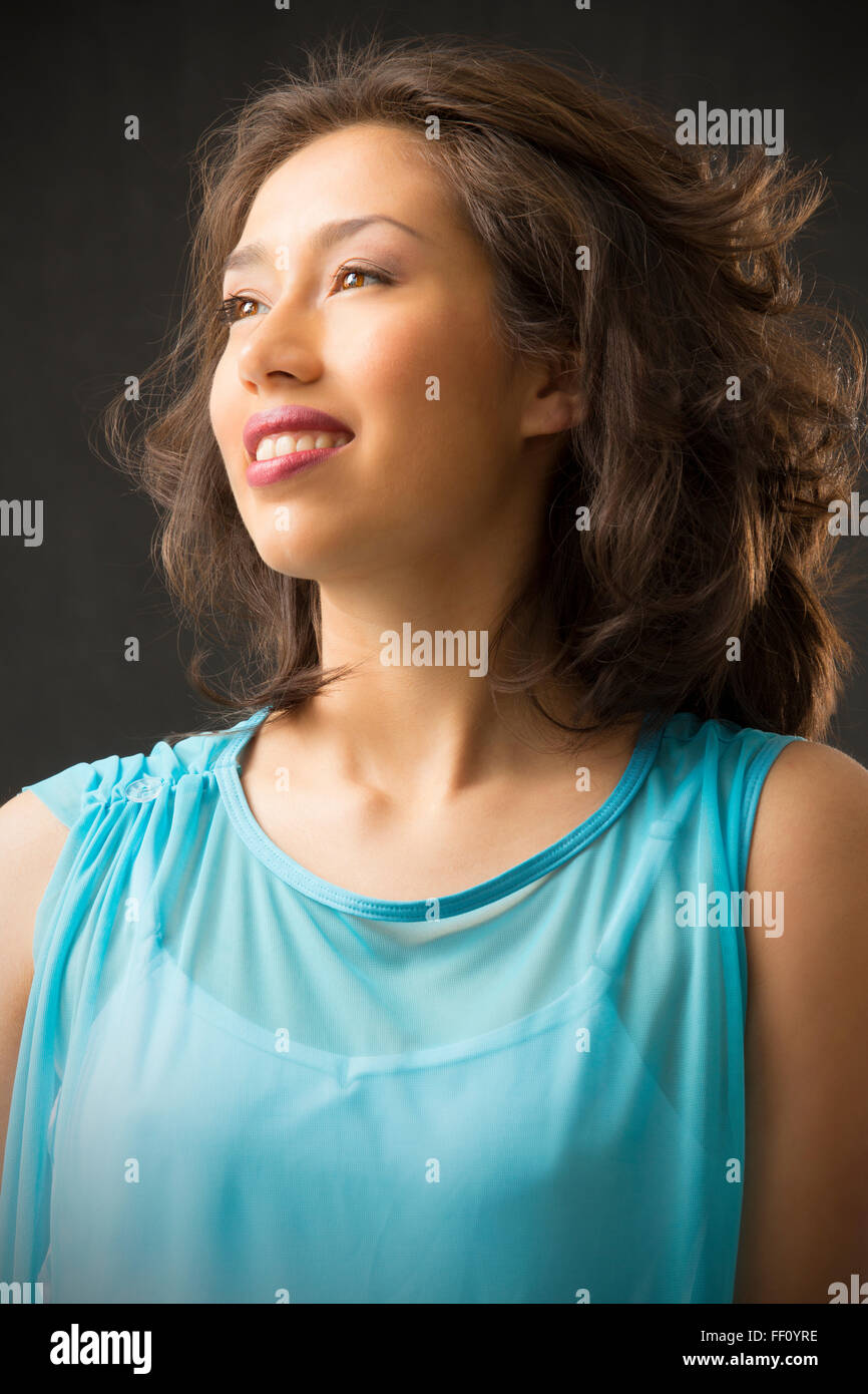 Elegant closeup portrait of beautiful, smiling young woman, looking ...