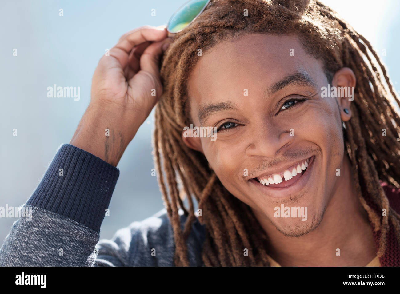 Mixed race man smiling Stock Photo - Alamy
