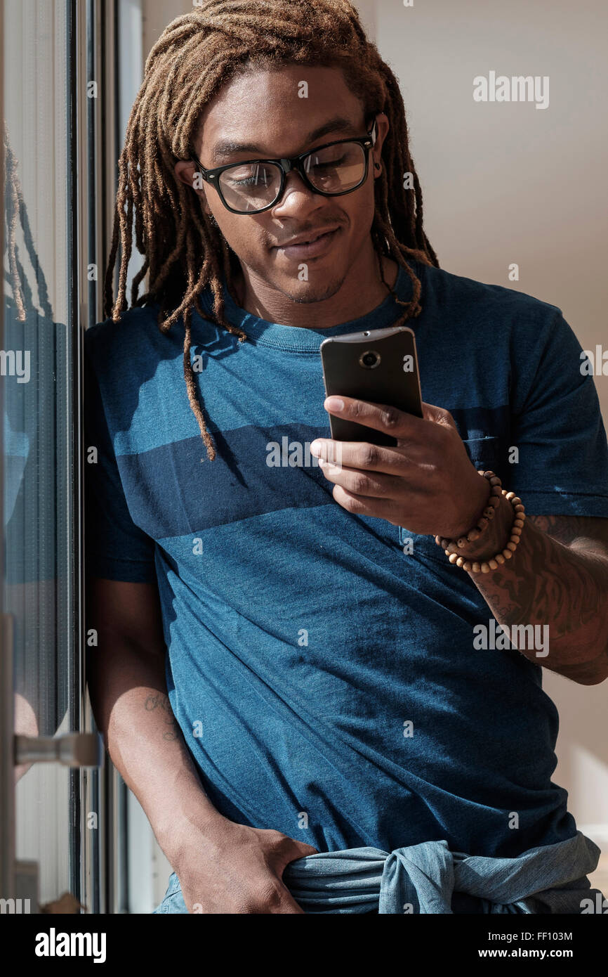 Man standing using phone hi-res stock photography and images - Alamy