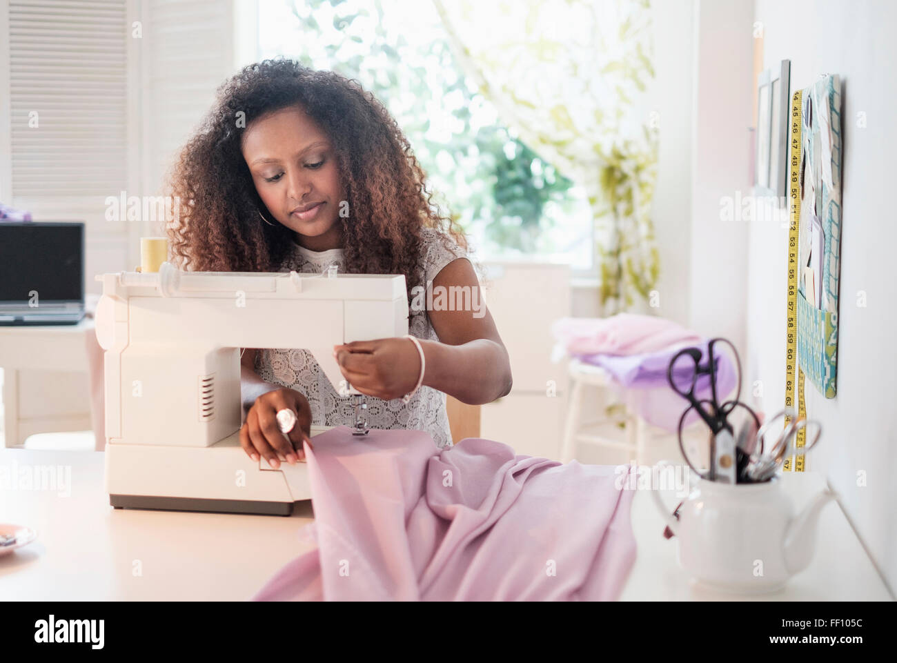 Woman working sewing machine fabric hi-res stock photography and images ...