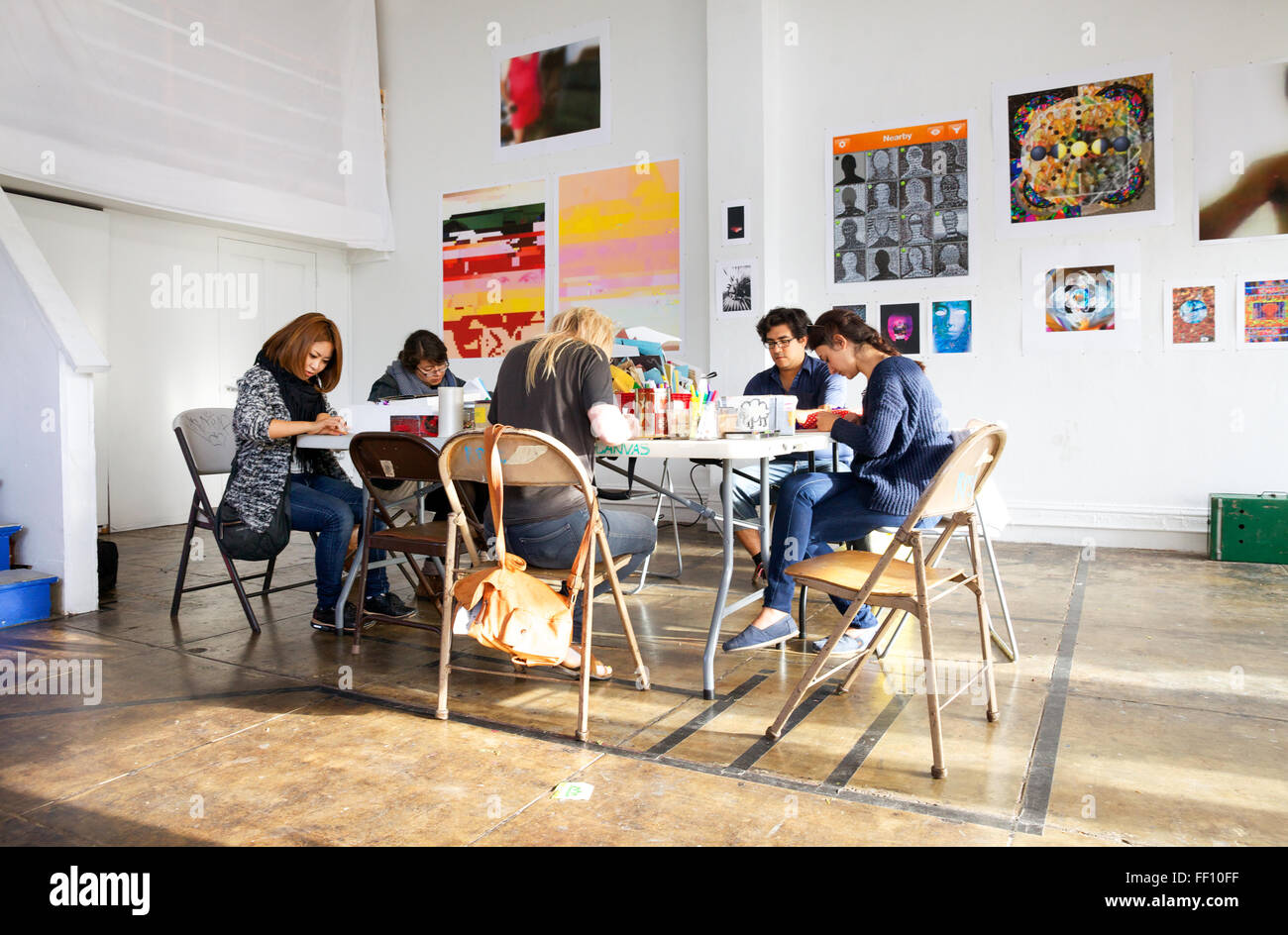 Group people sitting around table hi-res stock photography and images ...