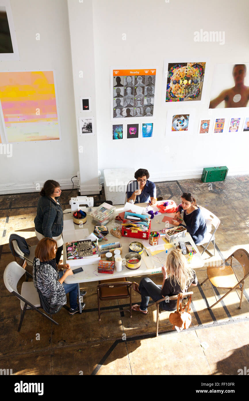 Group people sitting table in hi-res stock photography and images - Alamy