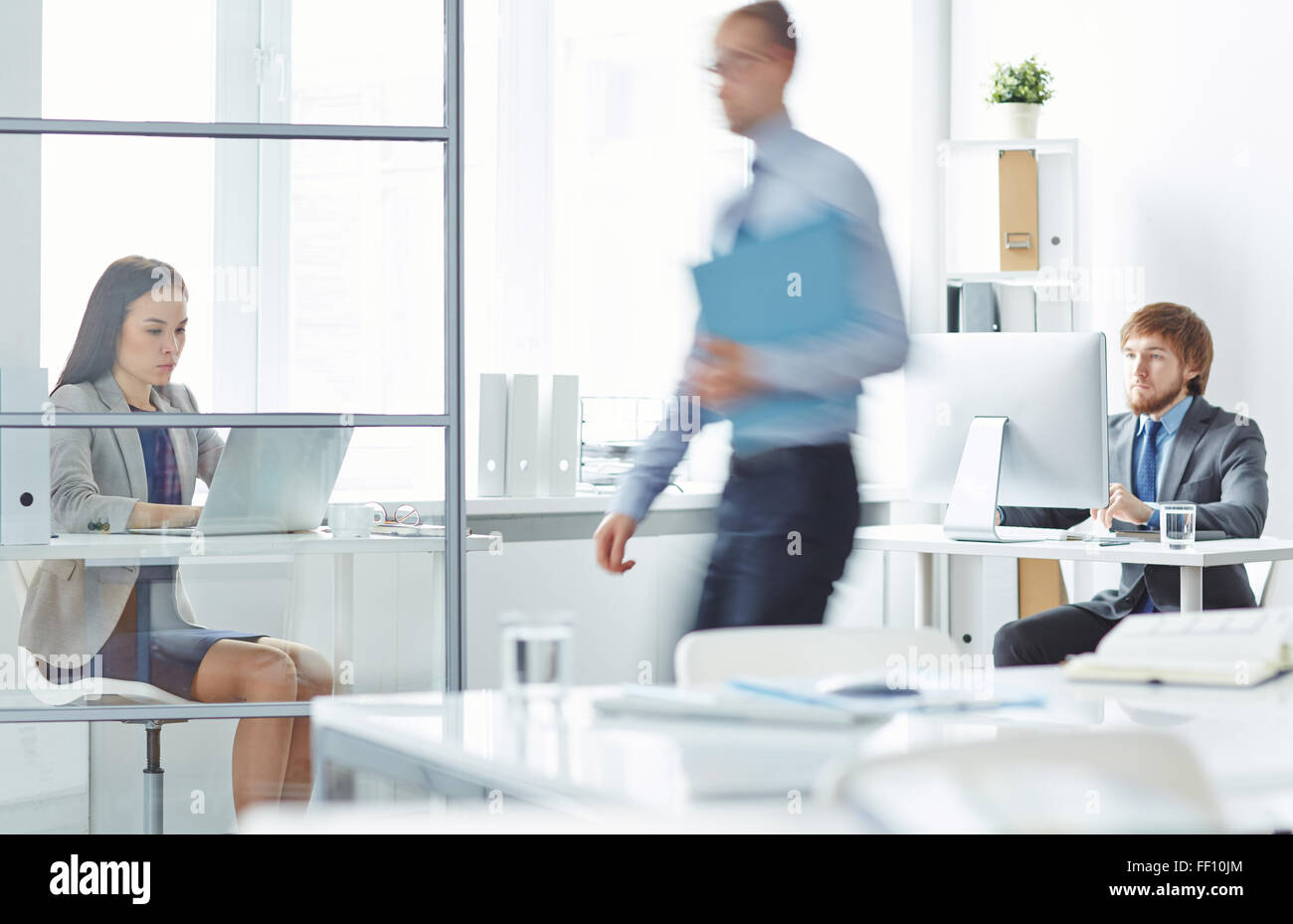 Team of young managers working in office Stock Photo - Alamy