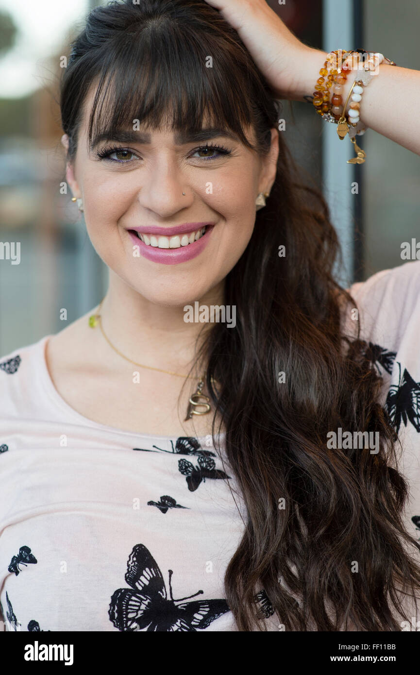 Hispanic woman smiling Stock Photo - Alamy