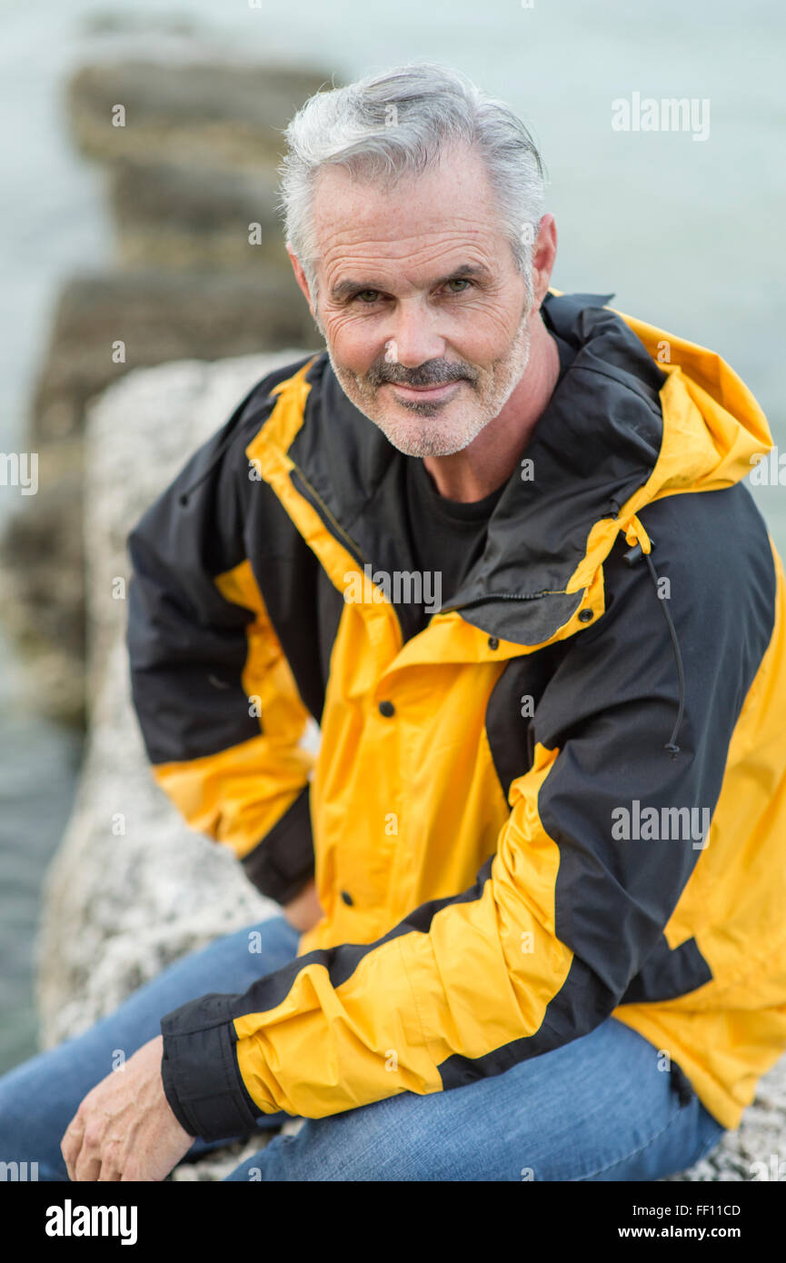 Older Caucasian man sitting outdoors Stock Photo - Alamy
