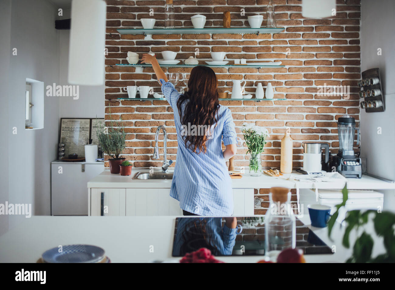 Rear view reaching up woman hi-res stock photography and images - Alamy